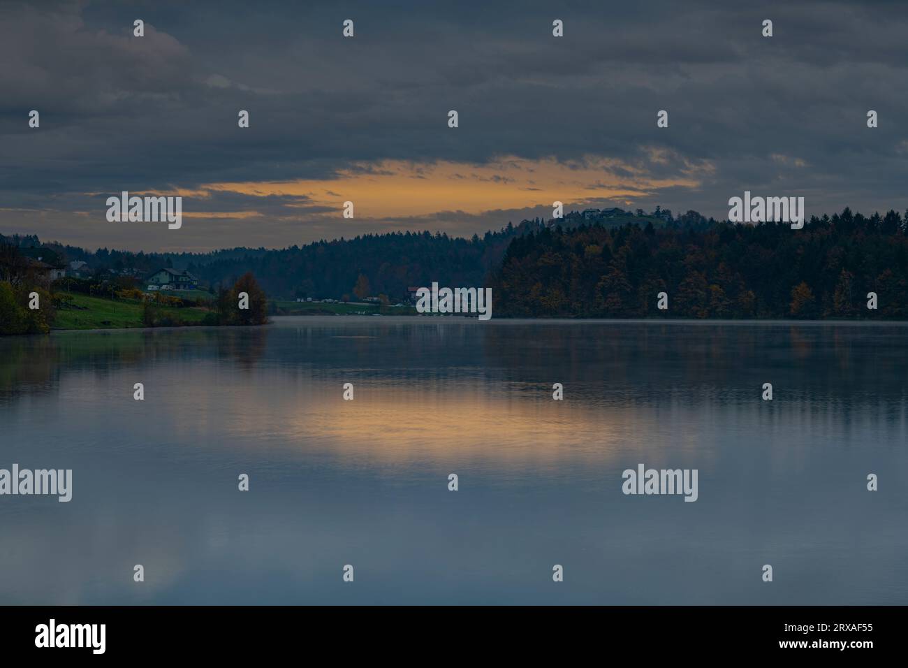Misty lake with magic reflection Stock Photo - Alamy