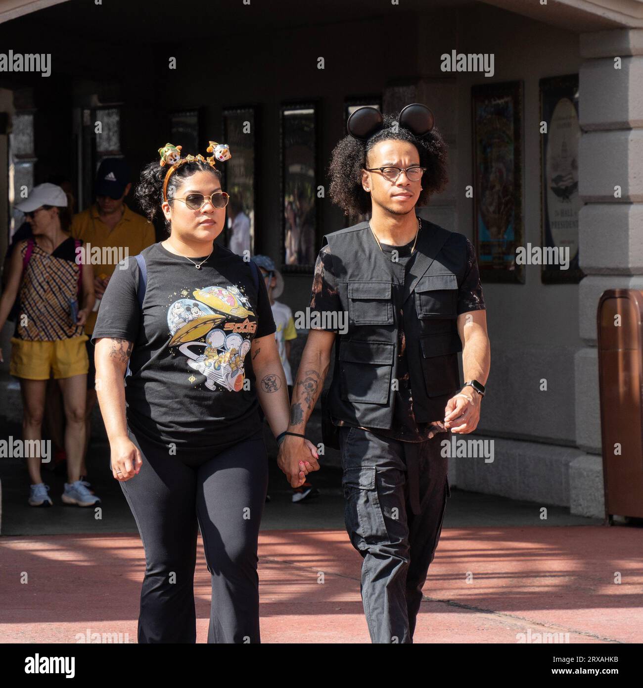 Orlando, USA - July 25th, 2023: A couple of tourists with headbands to ...