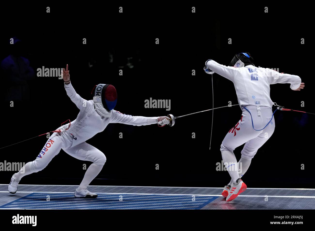 Sera Song of South Korea, left, competes with Man Wai Vivian Kong of ...