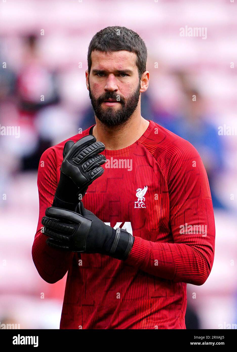 Liverpool goalkeeper Alisson Becker warms up ahead of the Premier ...