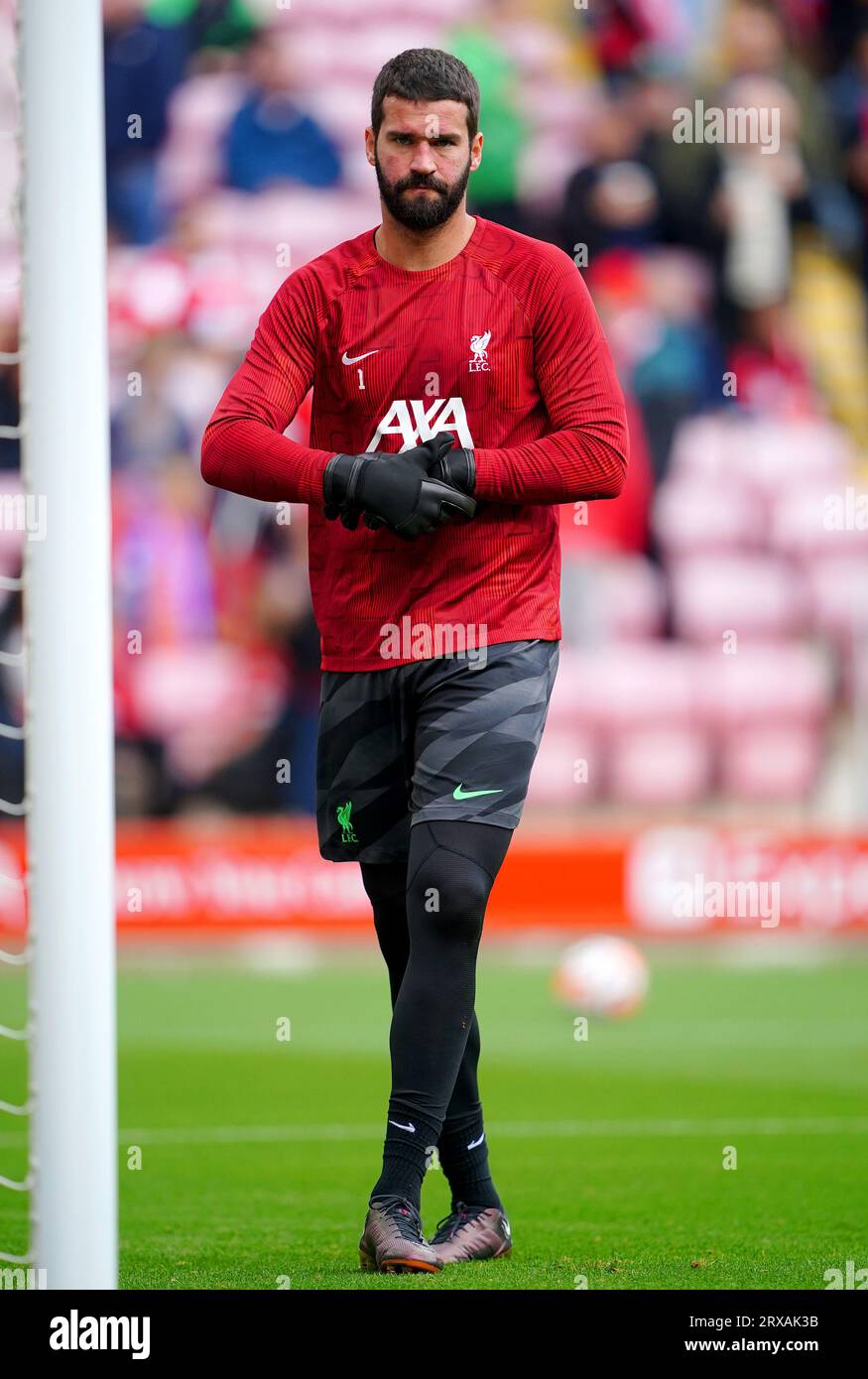 Liverpool goalkeeper Alisson Becker warms up ahead of the Premier ...