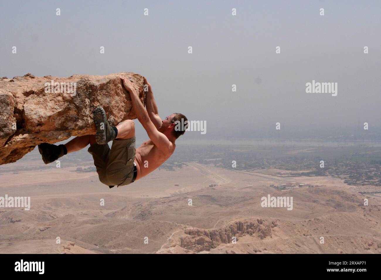 A brave climber hovers above the Valley of the Kings in Thebes West. In ...