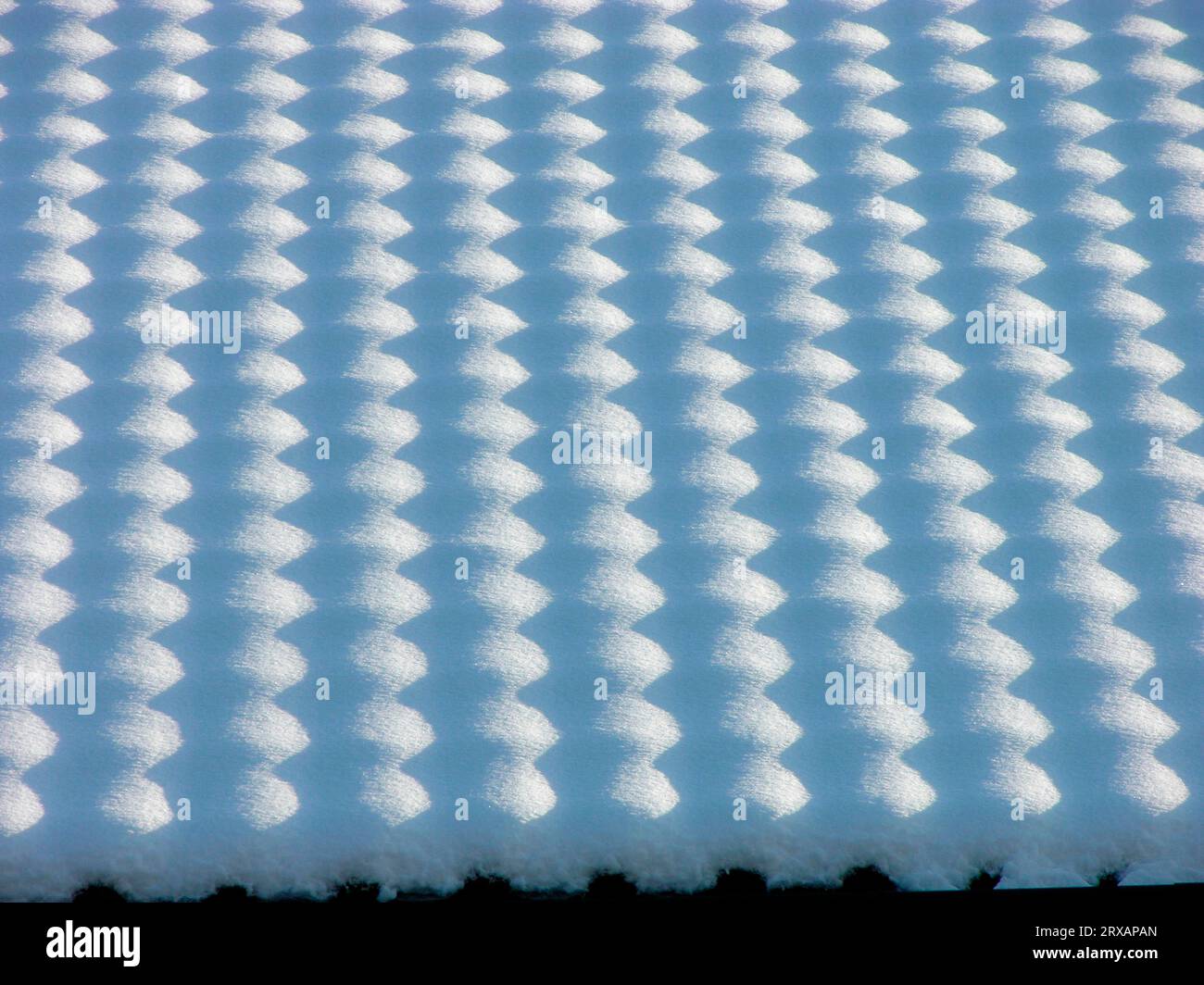 Snow-covered tiled roof Stock Photo - Alamy