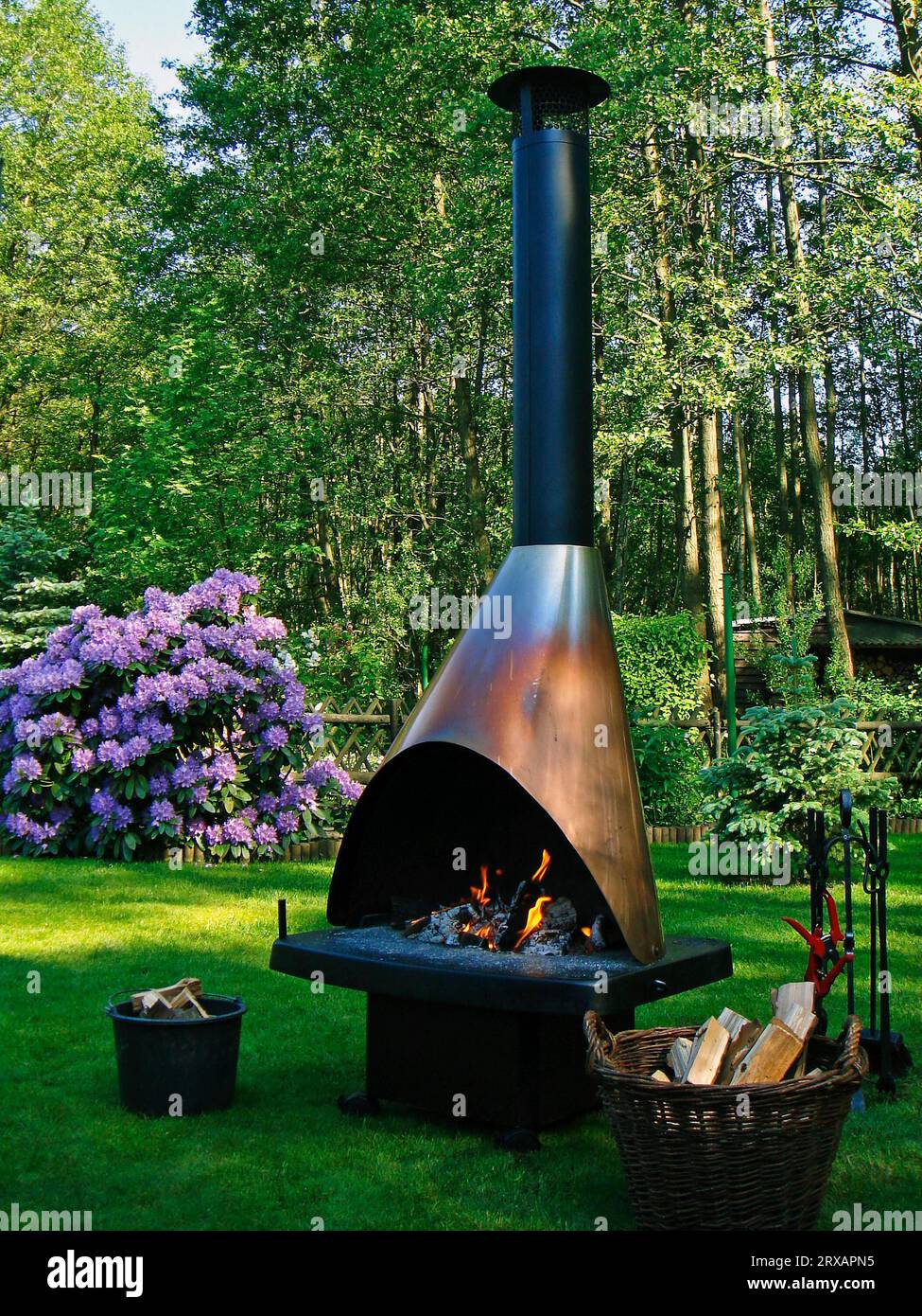 Wood stove with burning fire Stock Photo - Alamy