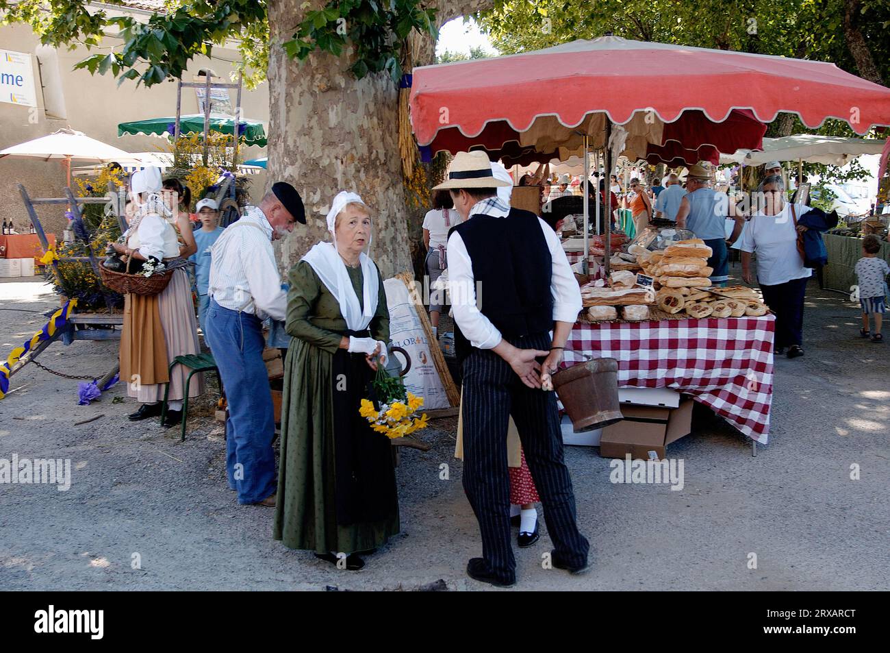 People in traditional clothes at market 'Fete de la Lavande ...