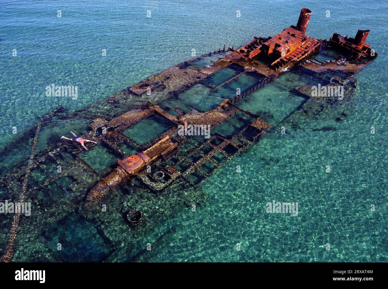 Greece, People dive into the crystal clear waters of the Mediterranean ...