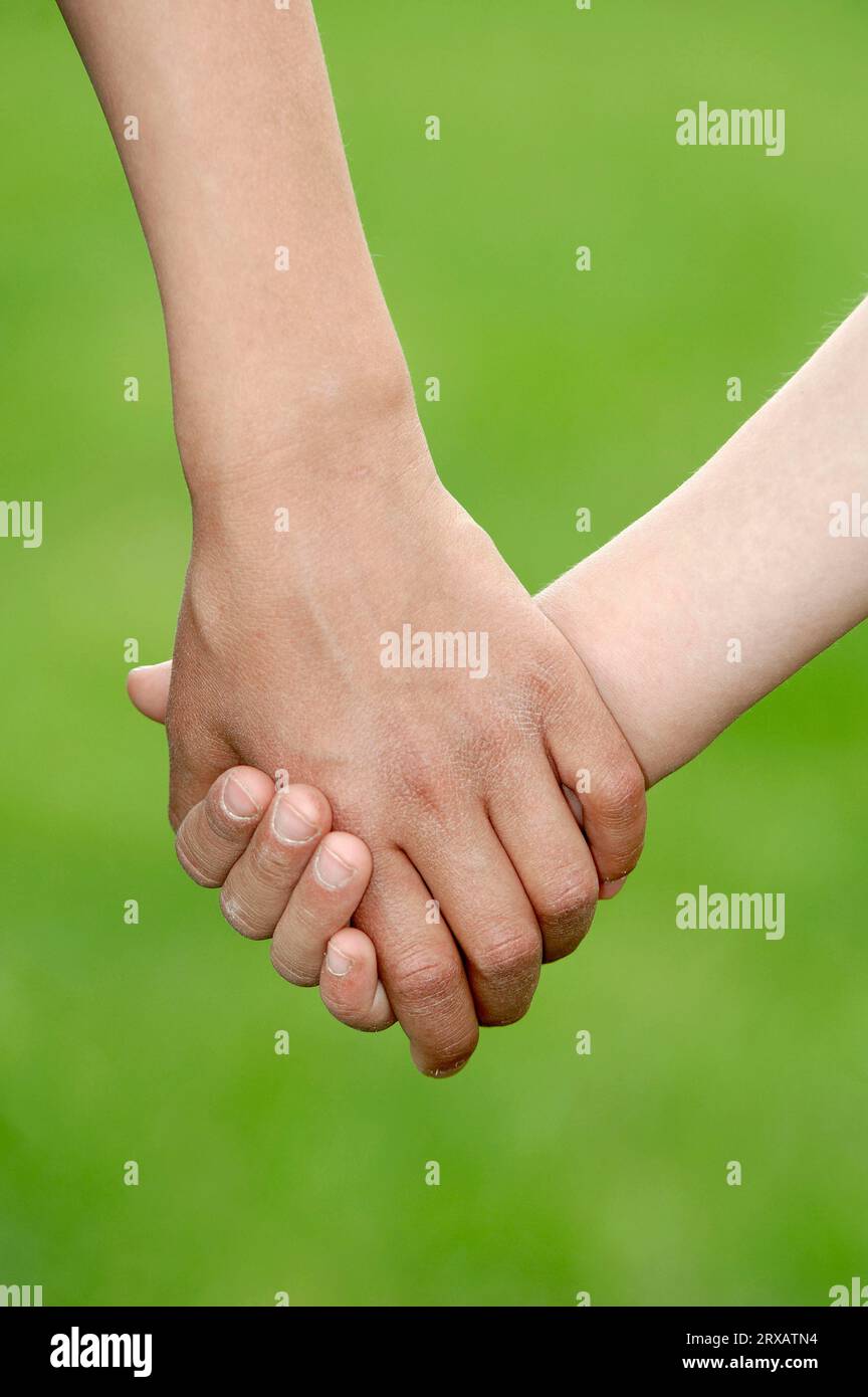Children's hands, hand in hand Stock Photo - Alamy