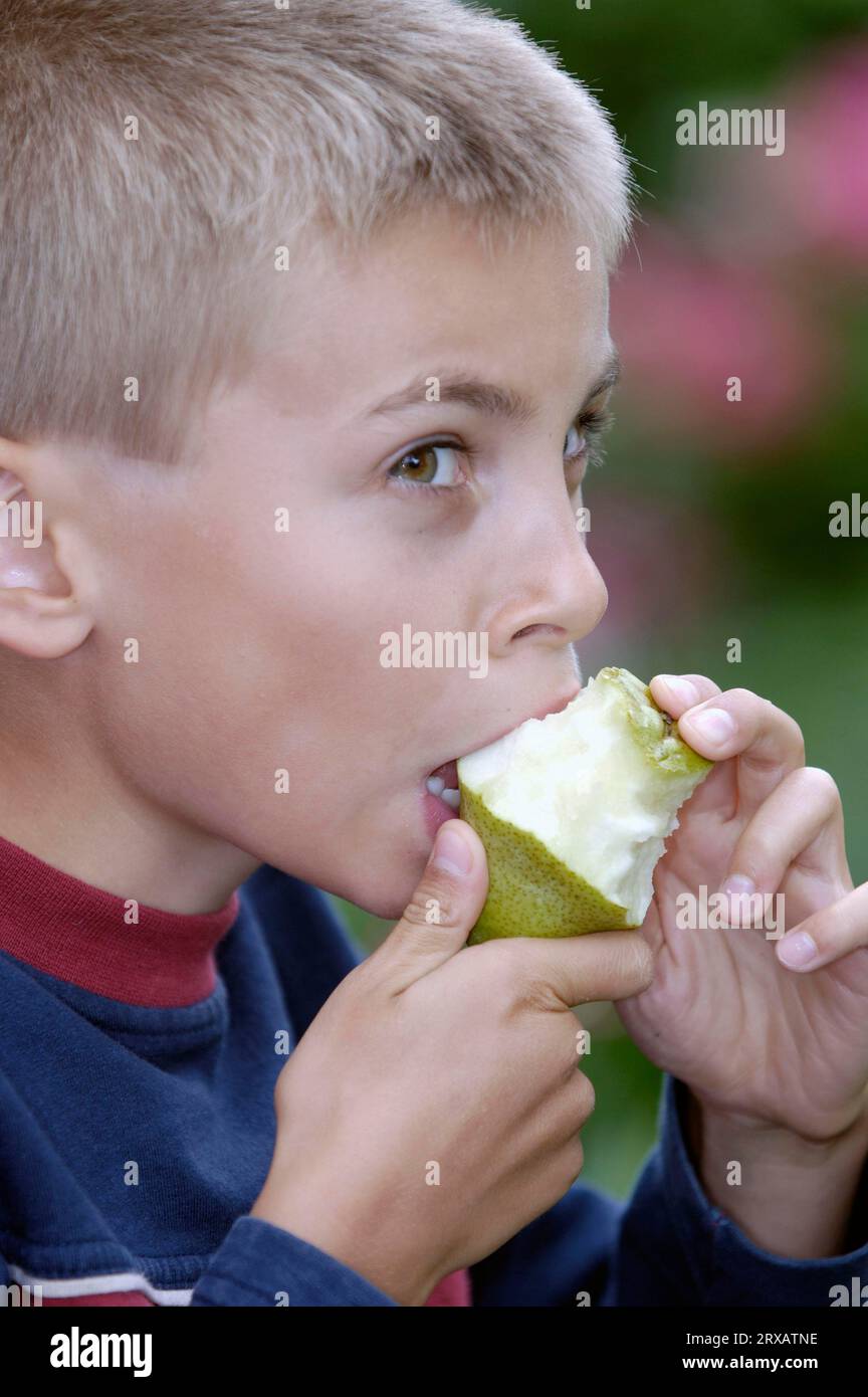 Eats pear hi-res stock photography and images - Alamy