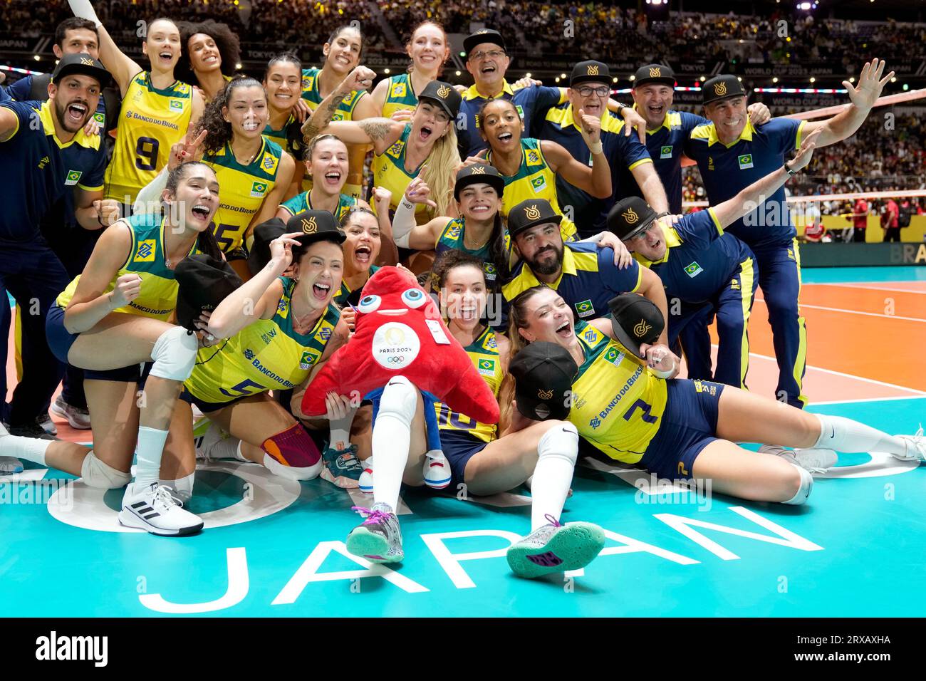 Brazil's team members pose for a photo after defeating Japan during ...