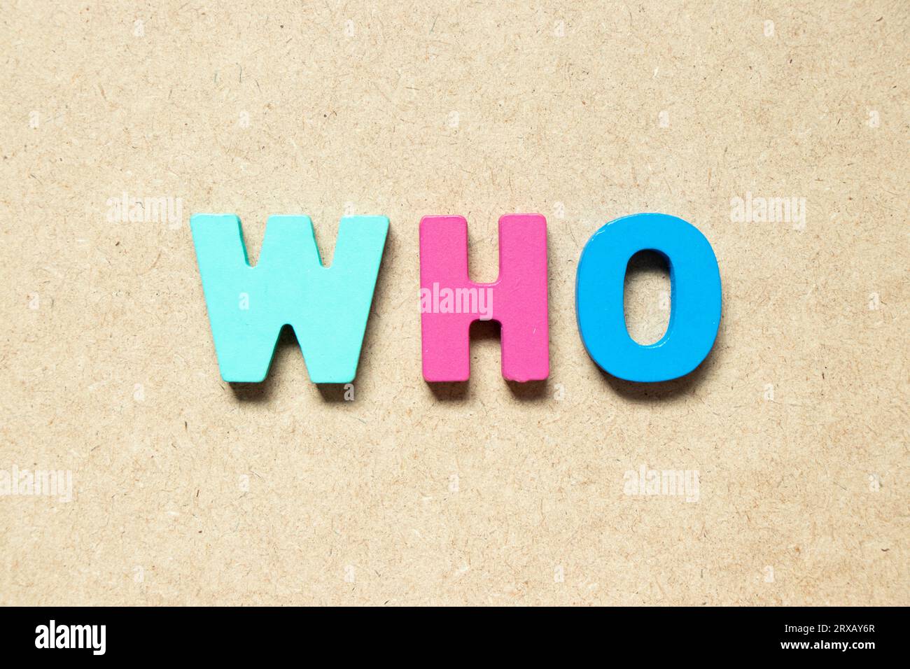 Color alphabet letter in word who on wood background Stock Photo - Alamy