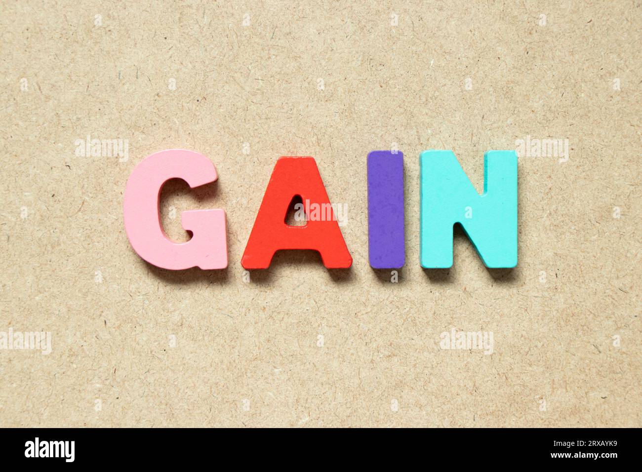 Color alphabet letter in word gain on wood background Stock Photo - Alamy