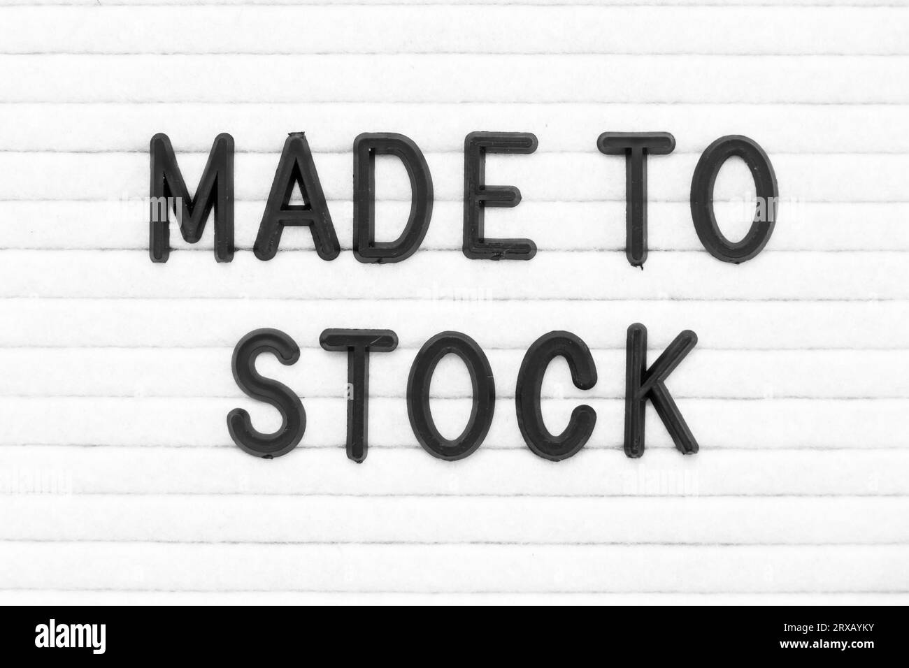 Black color letter in word made to stock on white felt board background ...