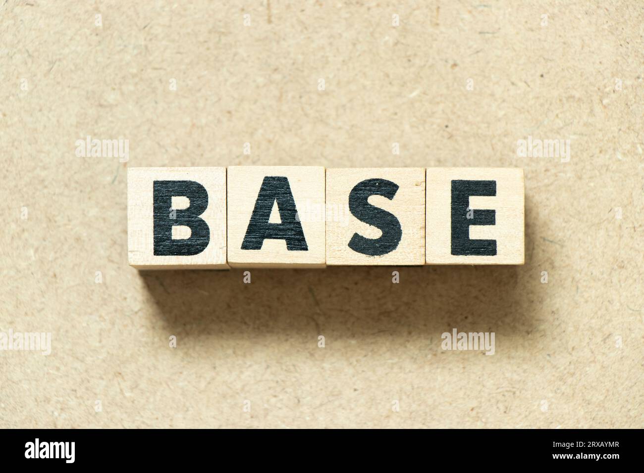 Alphabet letter block in word base on wood background Stock Photo - Alamy