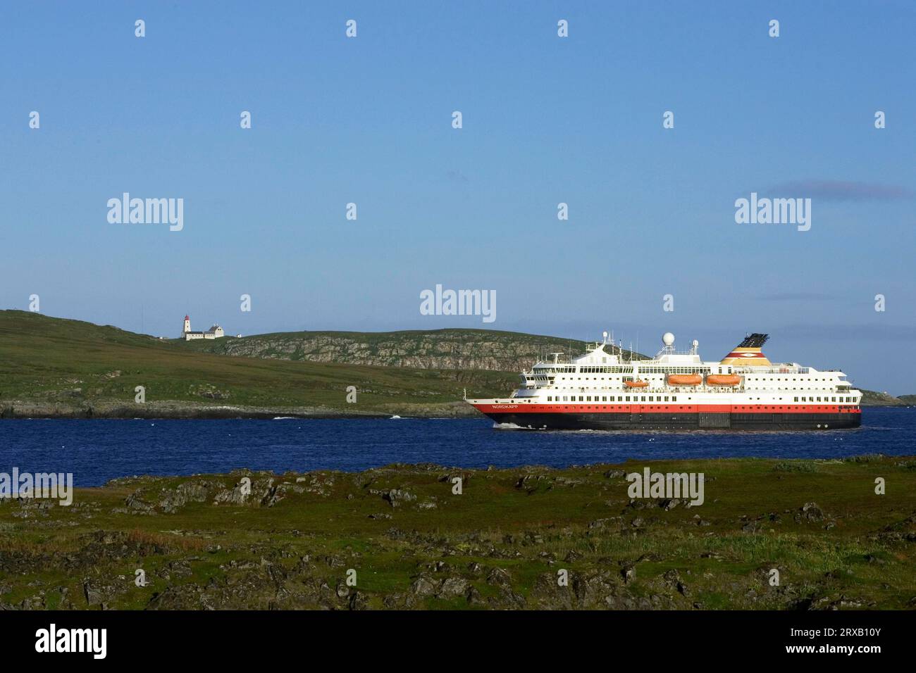 Ship near lighthouse, Reinoya, Vardo, Varanger Peninsula, Varangerfjord ...