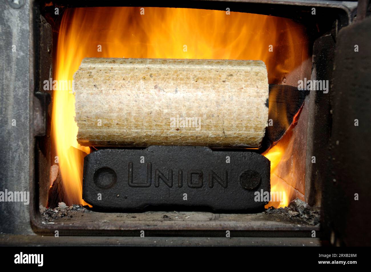 Fire with brown coal briquette and wood briquette, brown coal, brown ...