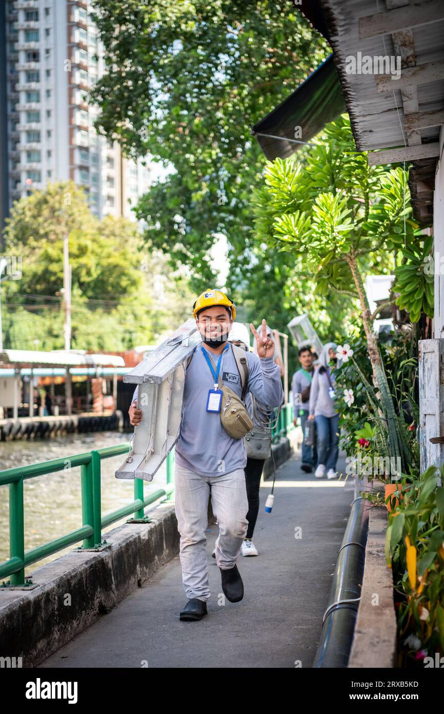 Some very cheery construction workers smile for my camera as they walk ...