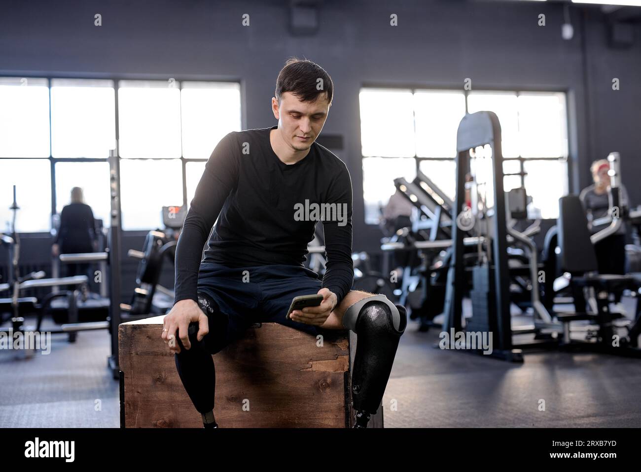 Handsome sportsman texting message in hi-res stock photography and ...