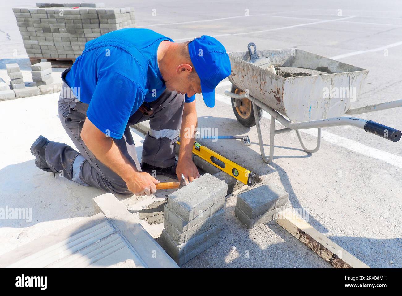 Professional bricklayer works at construction site and lays brick ...