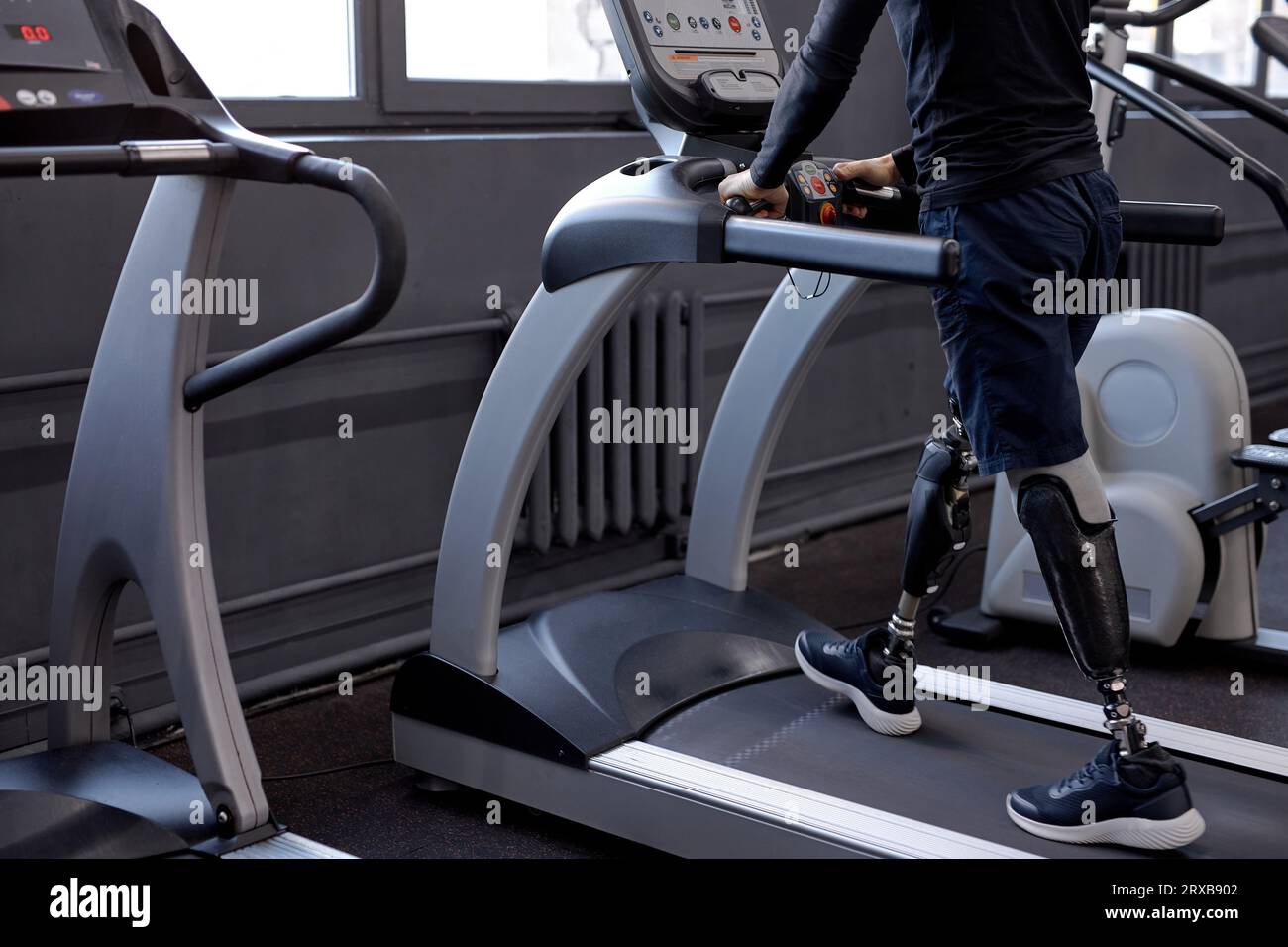 young disabled person doing efficient aerobic workout. focus on ...
