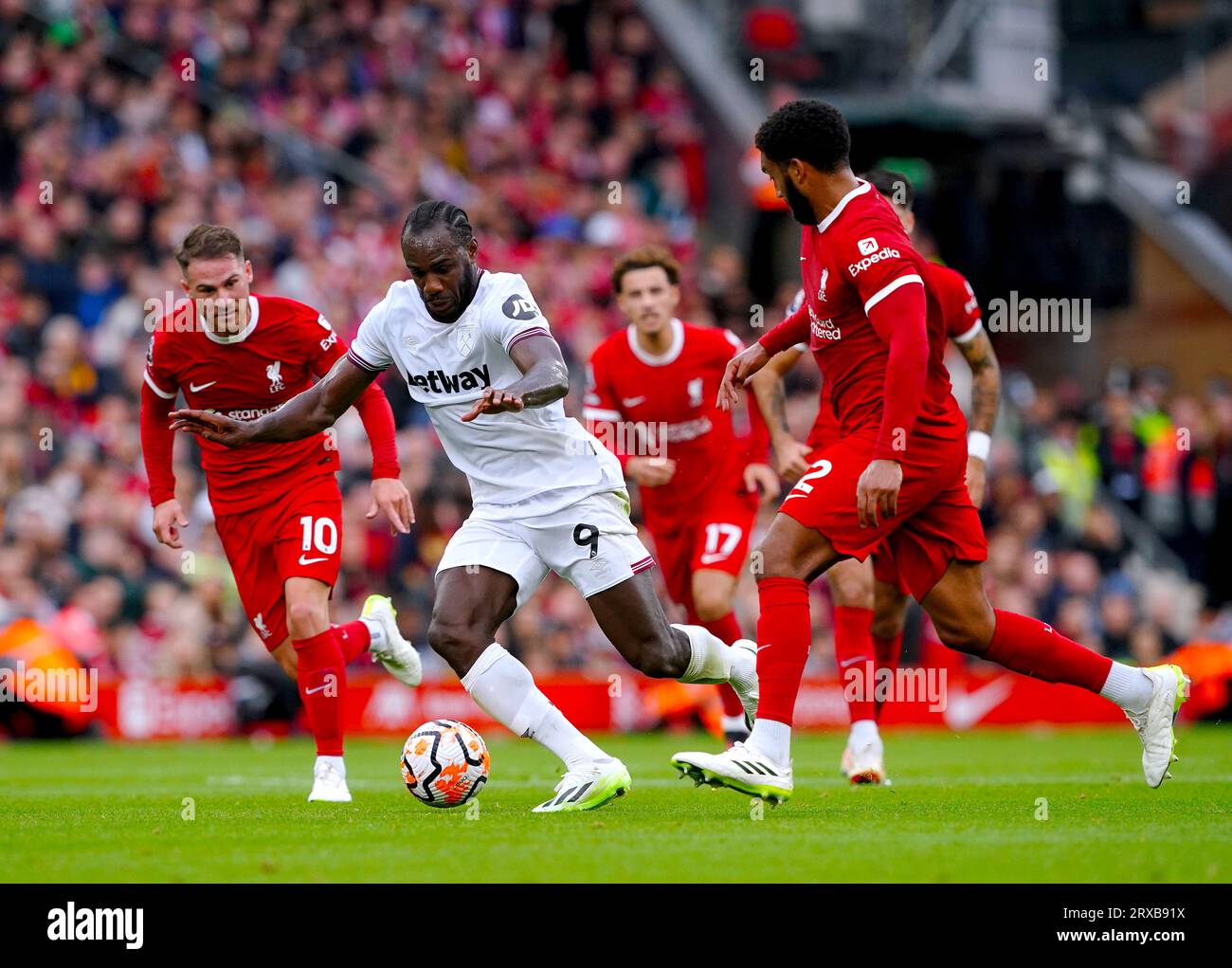 West Ham United's Michail Antonio (centre) battles for the ball with ...