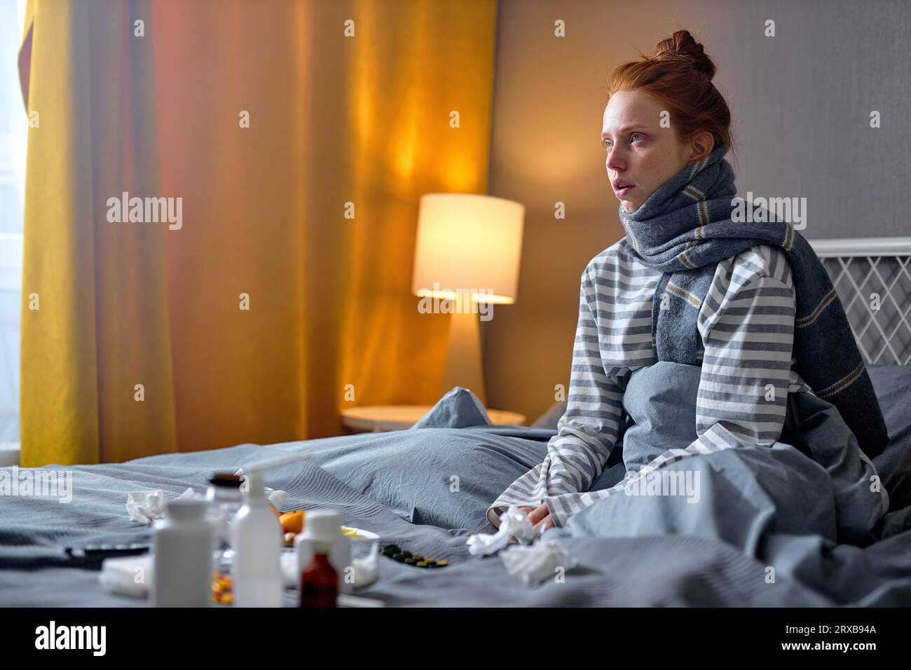 poor young beautiful ginger woman suffering from virus disease and ...
