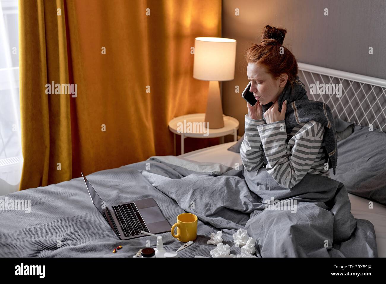 Bad feeling woman lying on bed with phone, calling doctor, ambulance ...