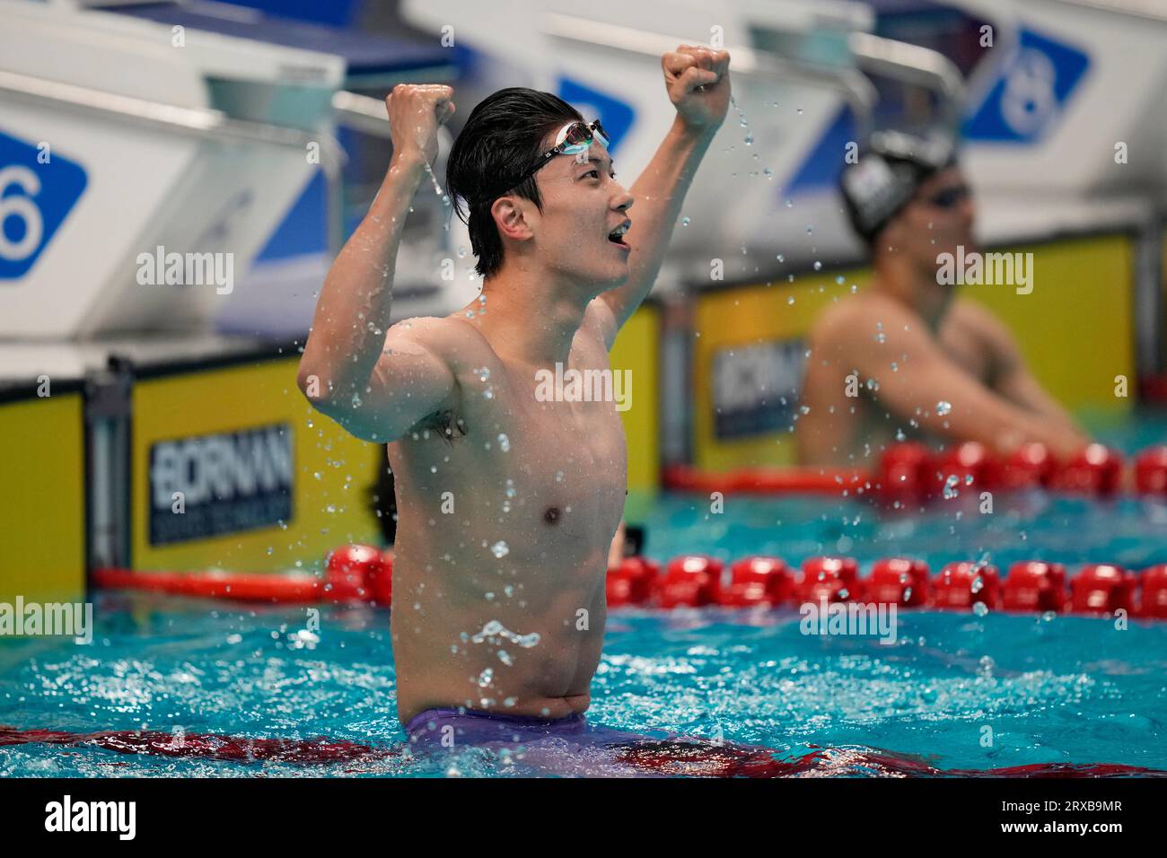 China's Wang Shun celebrates after winning the men's 200 meter ...