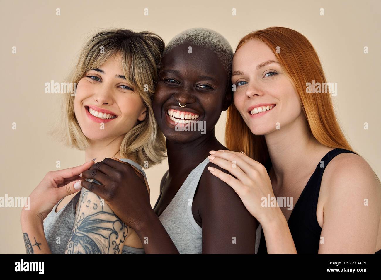 Three happy cool confident pretty gen z girls looking at camera beauty ...