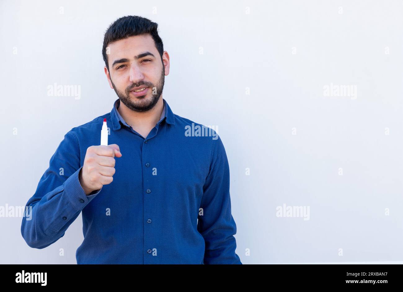 young male holding pen teaching and describing as teacher for student ...