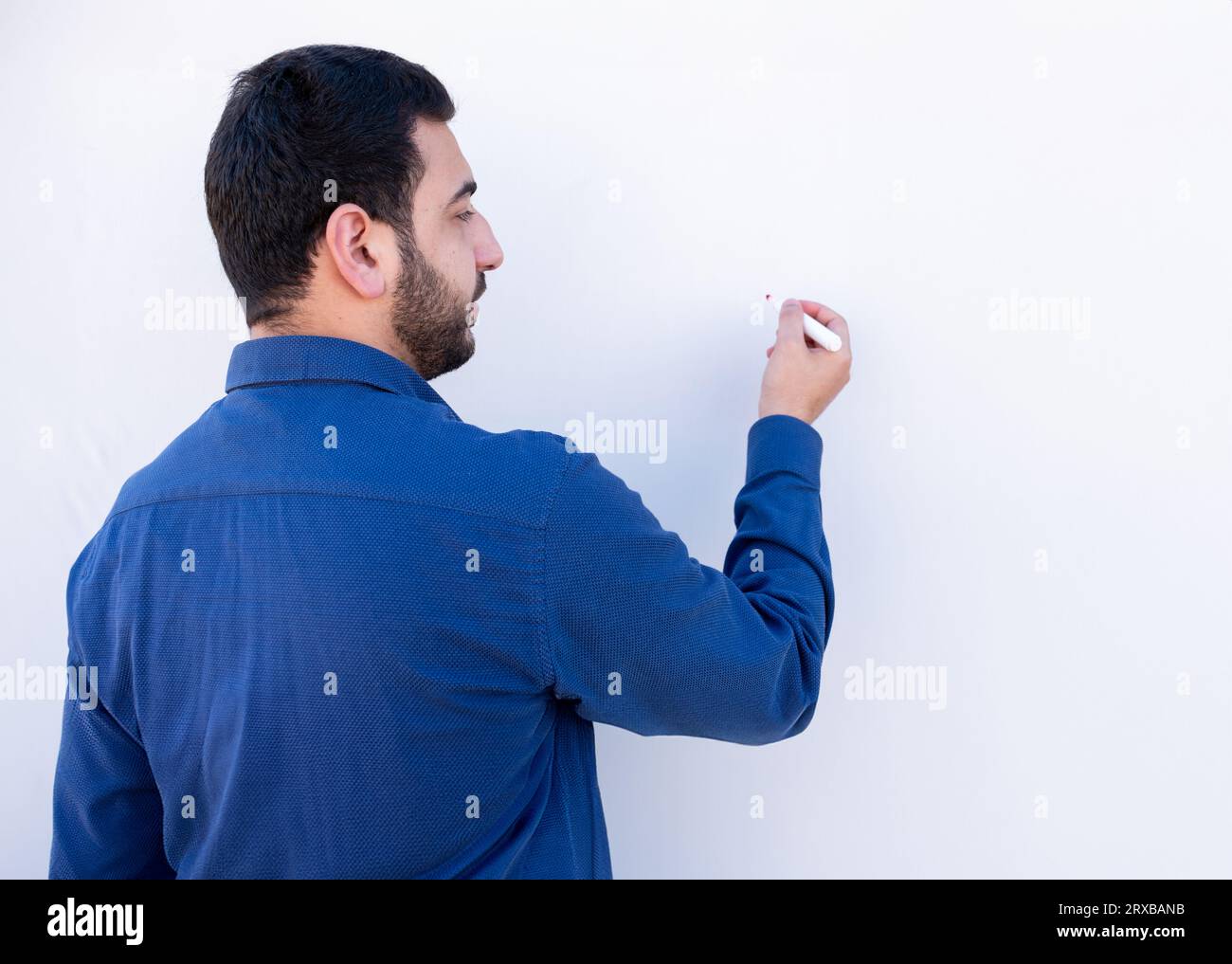 young male holding pen teaching and describing as teacher for student ...