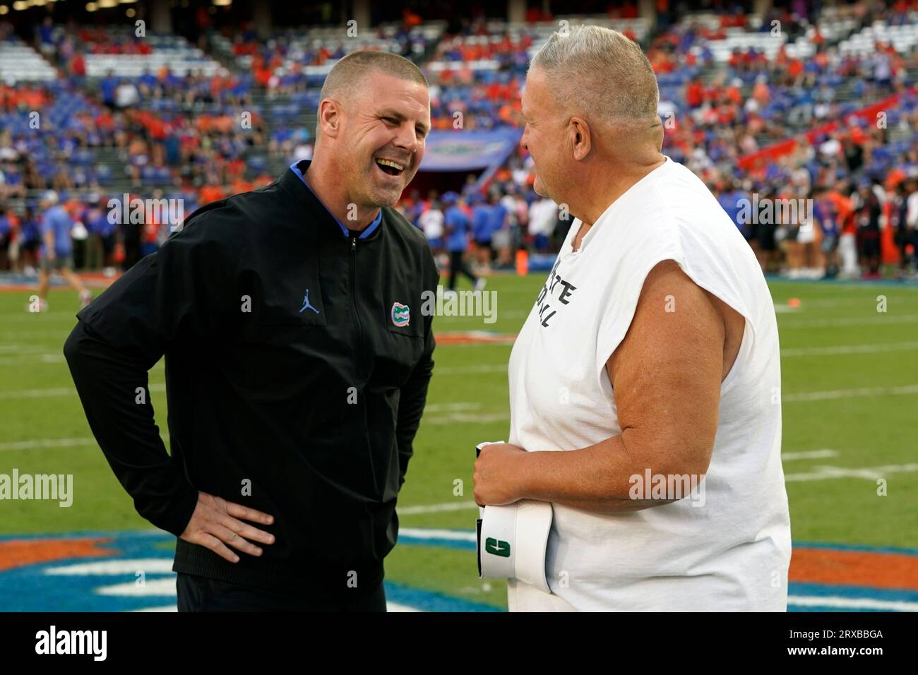 Florida head coach Billy Napier, left, and Charlotte head coach Biff ...