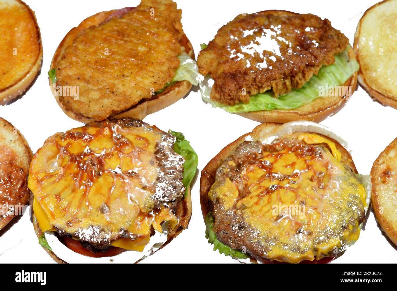 Pile of sesame buns of fried breaded chicken fillet patties, crisp ...