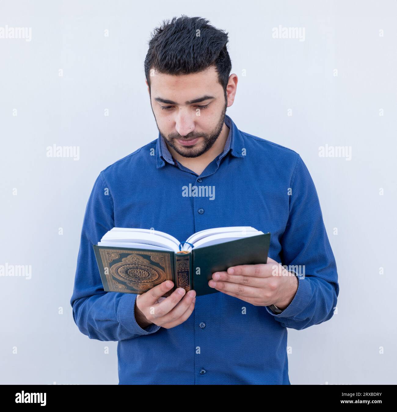 young male holding book teaching students and describing topics on ...