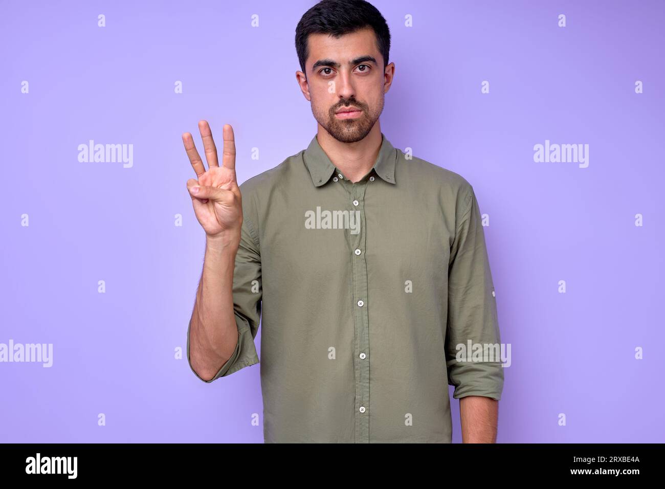 serious handsome man showing letter W w with fingers .the Alphabet in ...