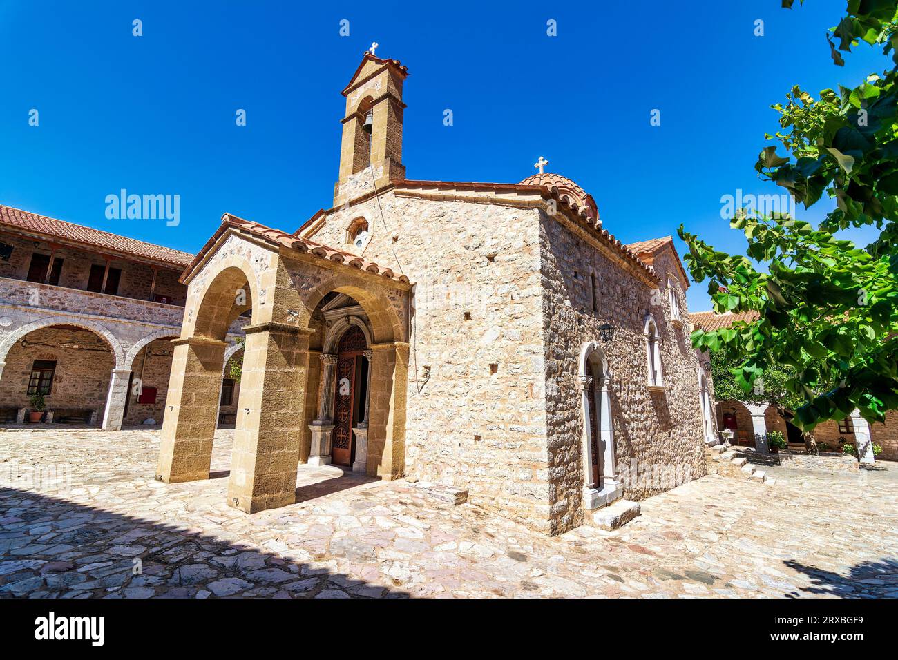 Voulkanos Monastery church on Ithomi mountain against a clear sunny sky ...
