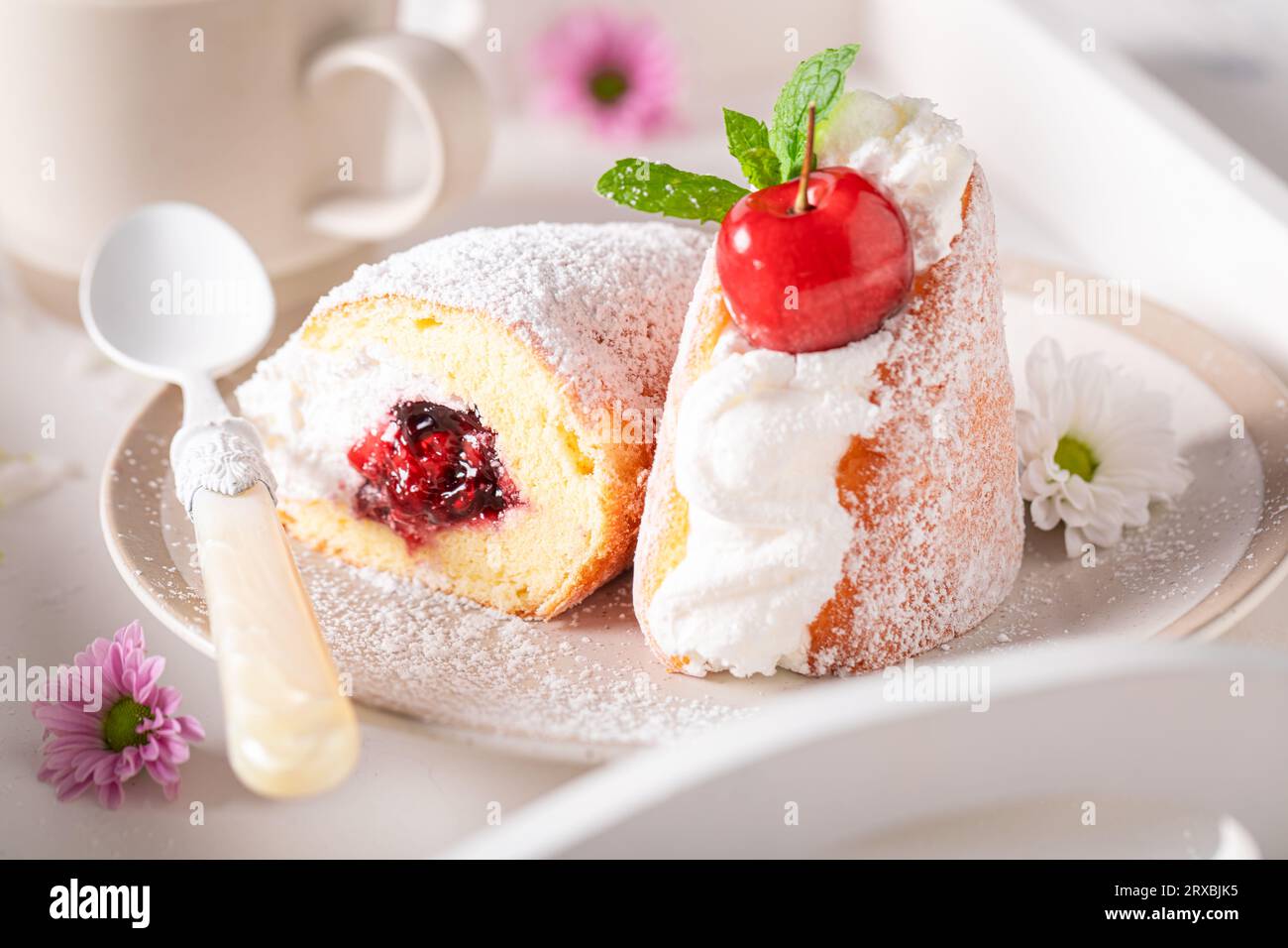 Tasty tacos made from sponge cake and cream. Caster sugar and stuffed ...