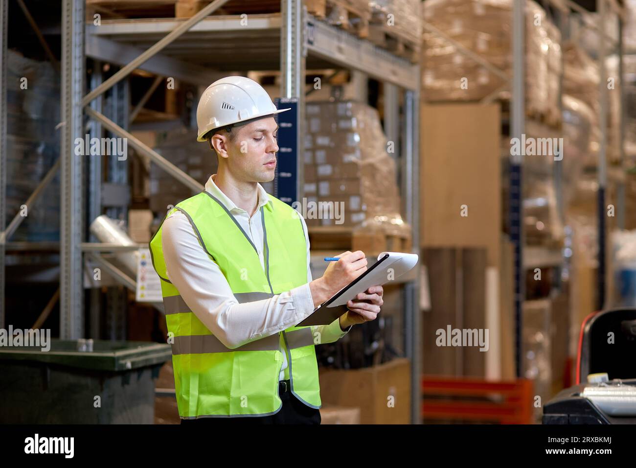 Manager man worker doing stocktaking of product management on shelves ...