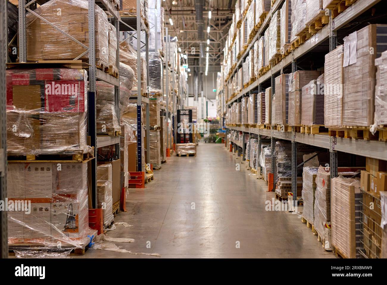 warehouse interior with shelves, pallets and boxes. Typical production ...