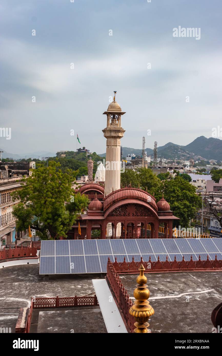ancient holy jain trample entrance with cloudy sky and mountain ...
