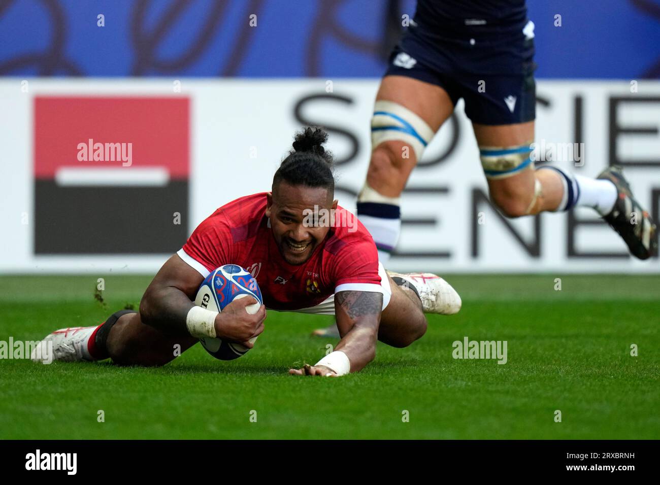 Tonga's Solomone Kata scores a try during the Rugby World Cup Pool B ...