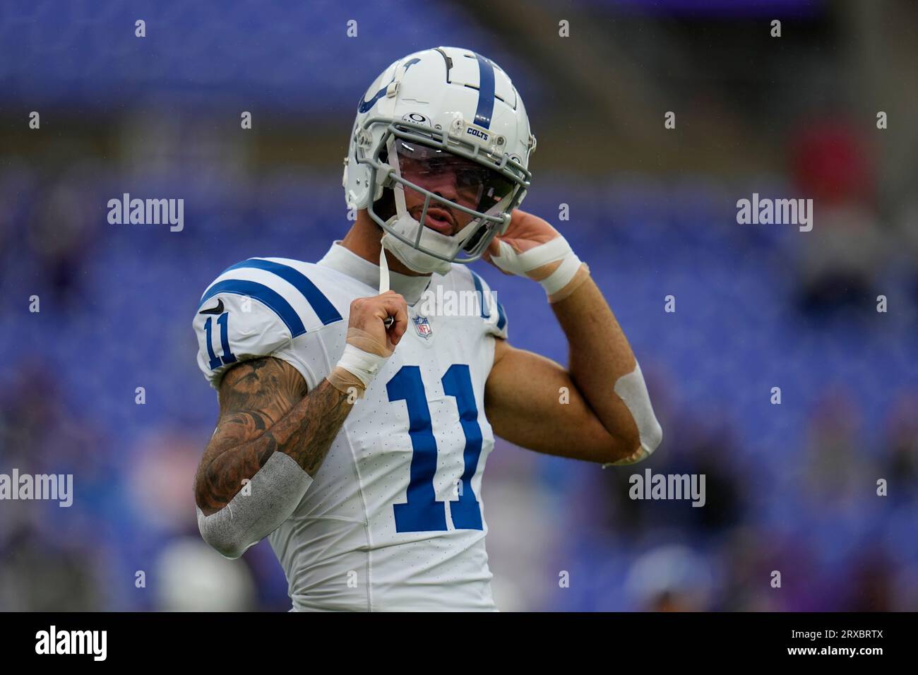 Indianapolis Colts' Michael Pittman Jr. stretches the helmet before an ...
