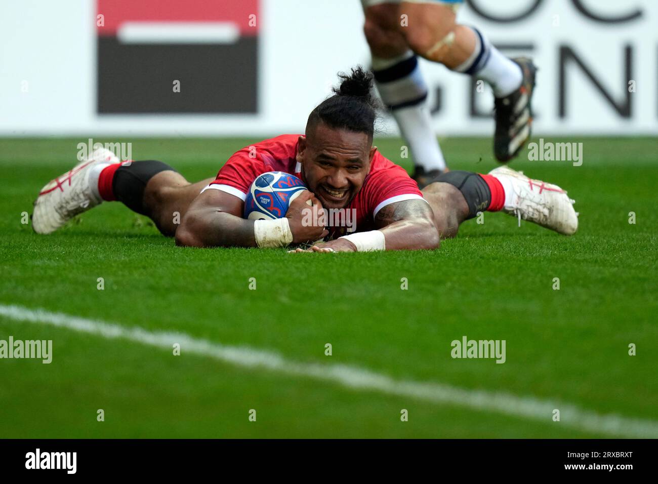 Tonga's Solomone Kata scores a try during the Rugby World Cup Pool B ...
