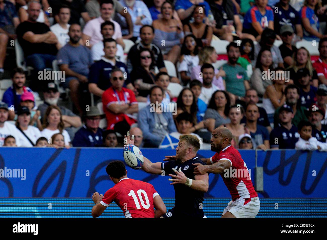 Scotland's Kyle Steyn, center, and Tonga's Afusipa Taumoepeau, right ...