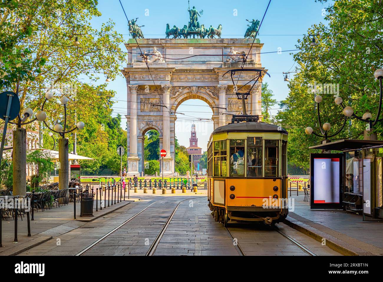 View of the Peace Arch with yellow tram in Milan, Italy Stock Photo - Alamy