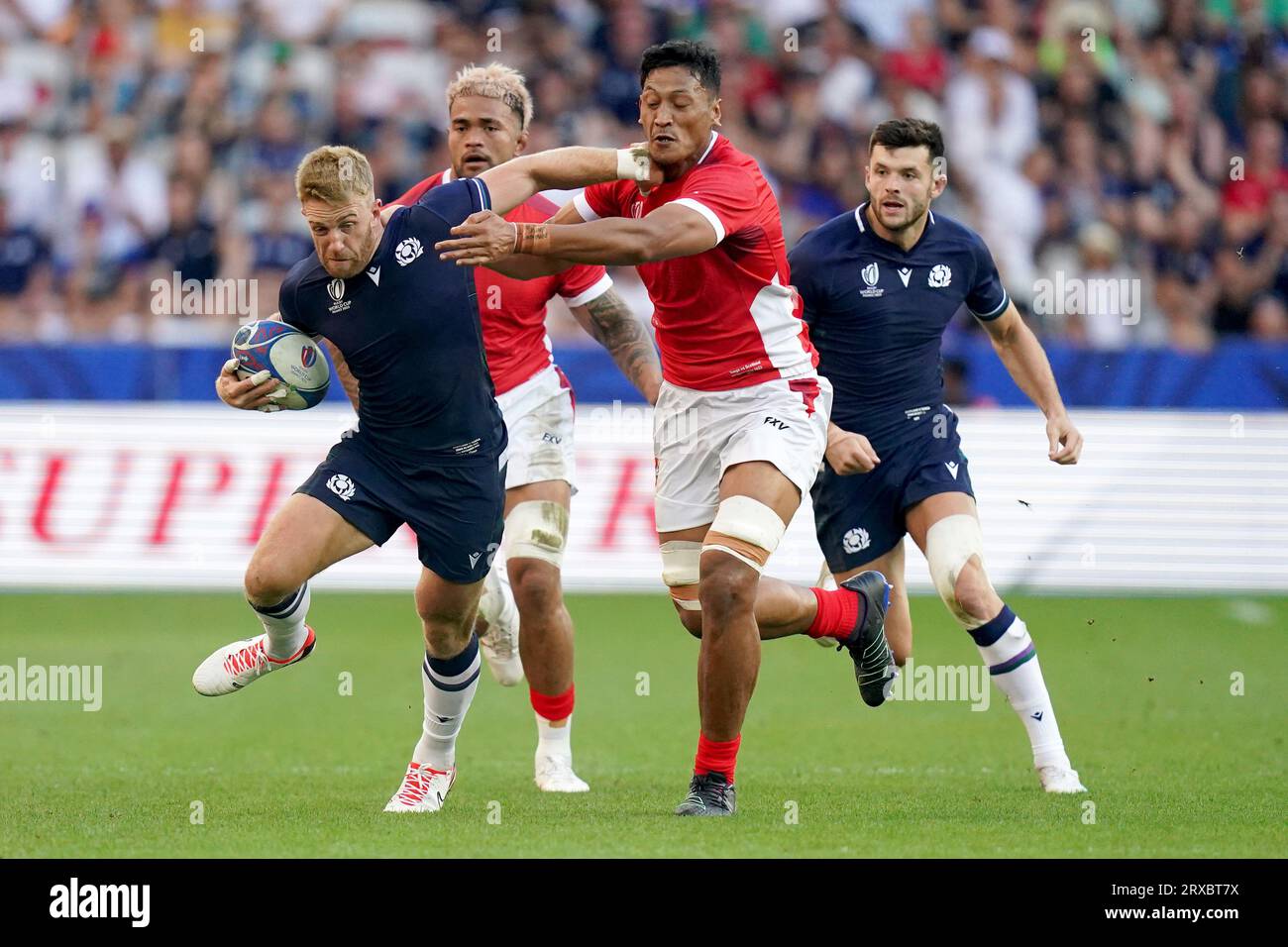 Scotland's Kyle Steyn (left) and Tonga's Tanginoa Halaifonua battle for ...