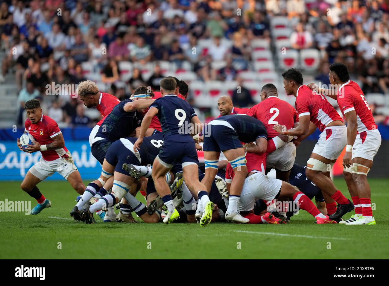 Tonga's Augustine Pulu, left, breaks a away from a scrum during the ...