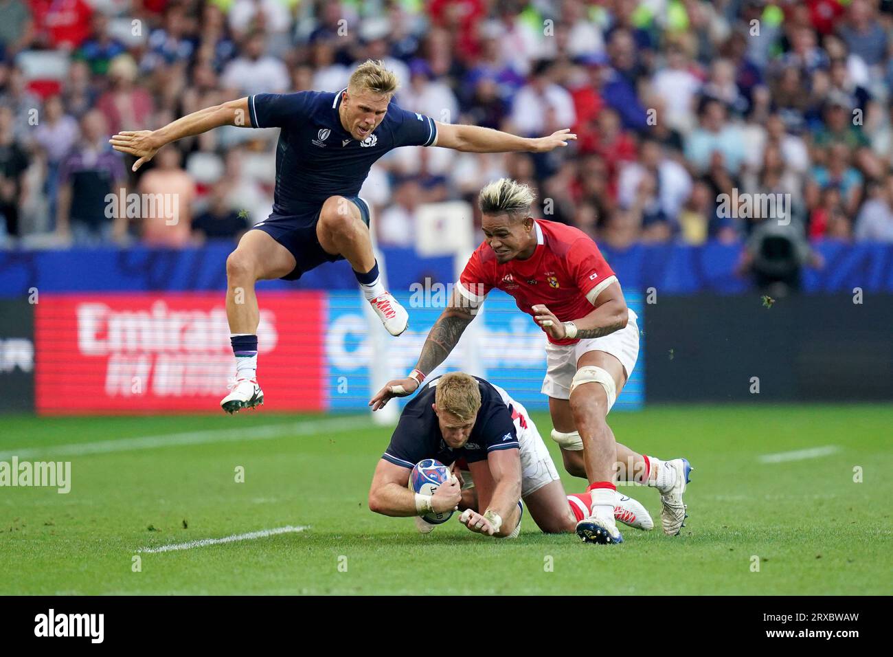 Tonga's Pita Ahki tackles Scotland's Kyle Steyn during the Rugby World ...
