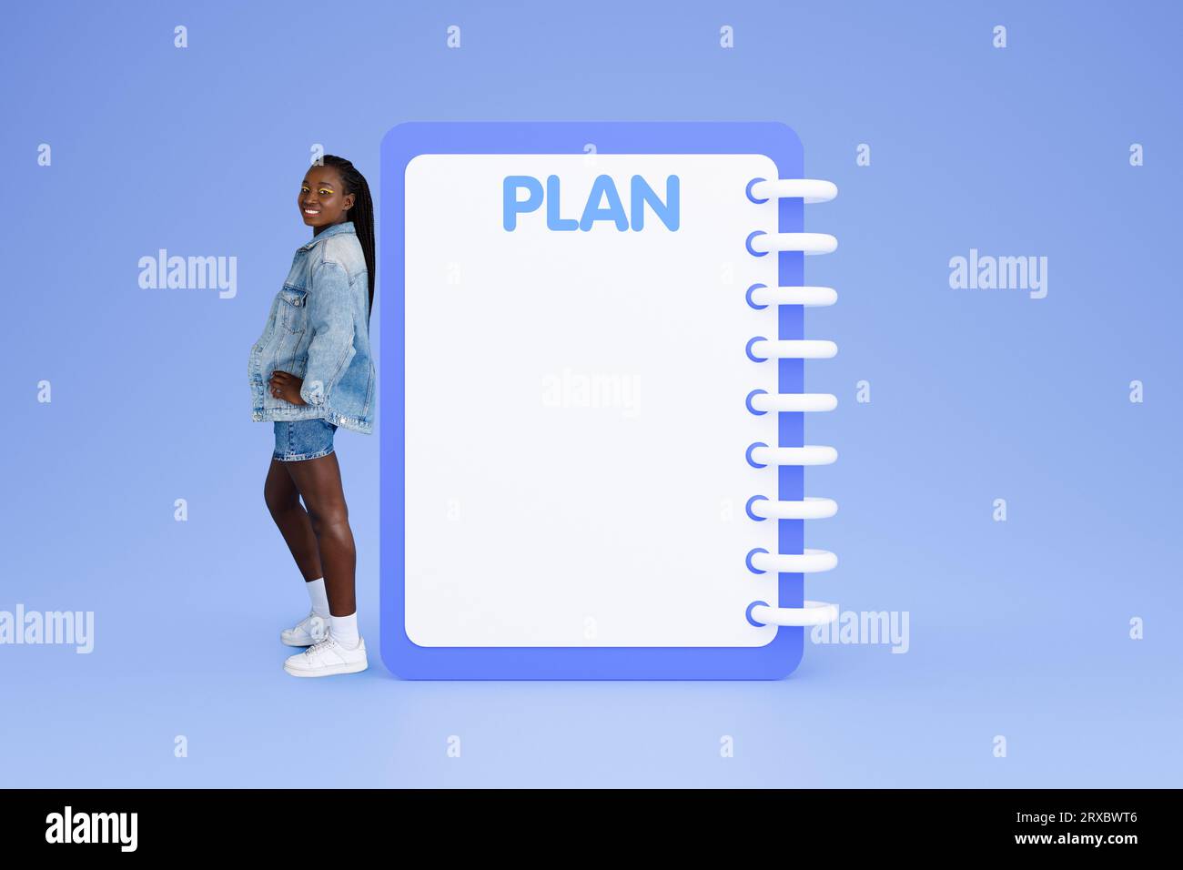 Smiling young black lady near large plan, with copy space ...