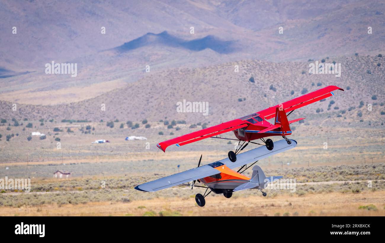 Flying close to each other two airplanes in flight Stock Photo - Alamy