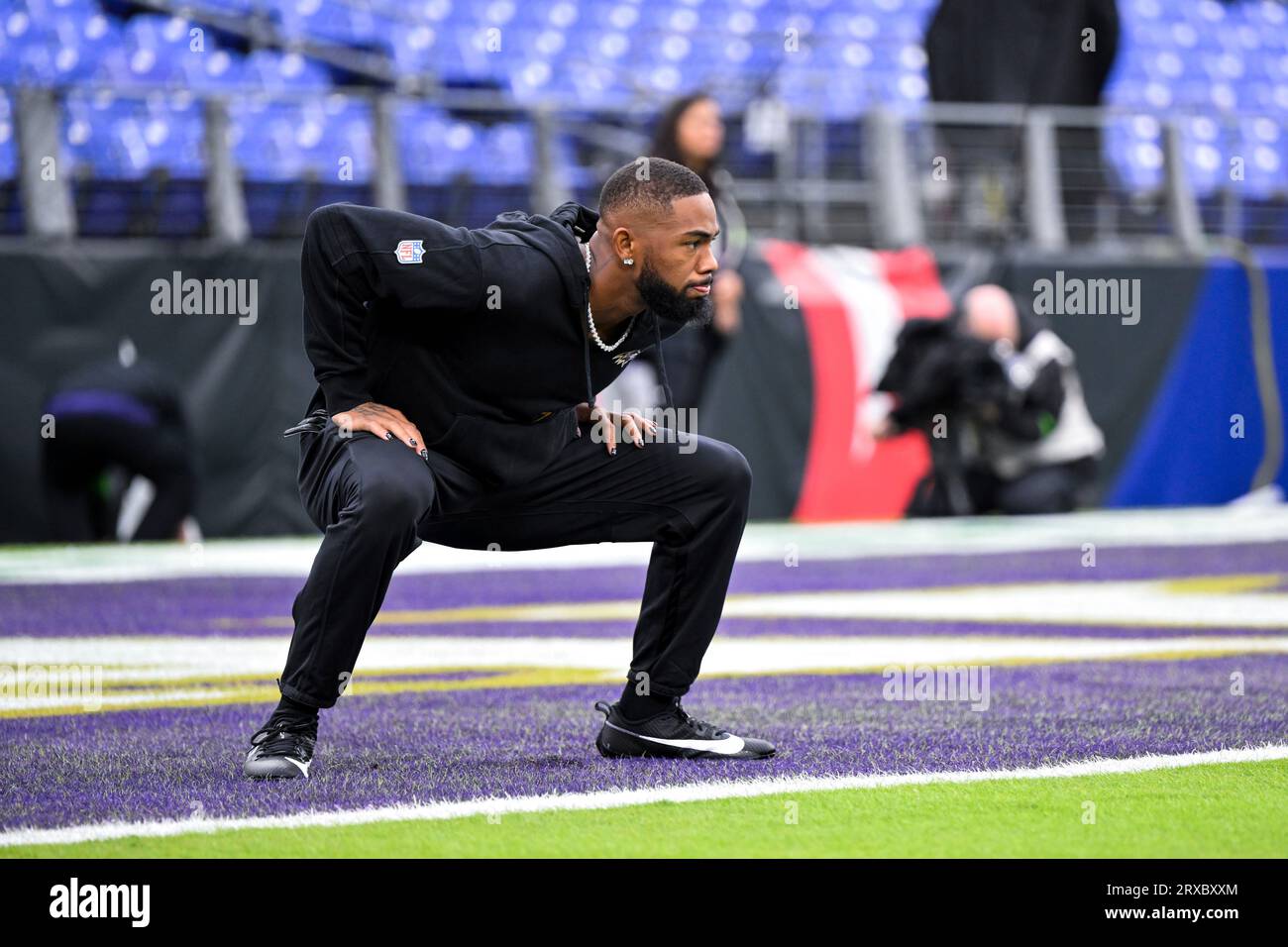 Baltimore Ravens wide receiver Rashod Bateman stretches before an NFL ...
